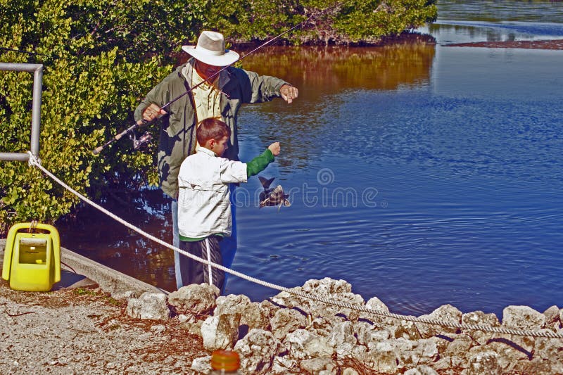 Boy catches fish editorial photography. Image of fish - 28606077