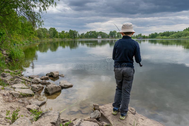 Boy catching fish stock photo. Image of reflection, season - 175019010