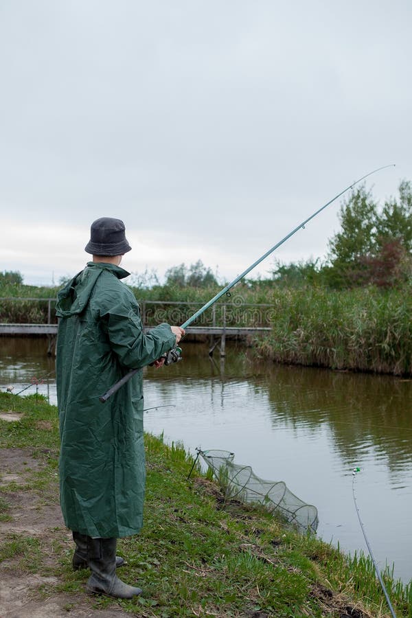 The Boy is Catching a Net by the Lake Stock Photo - Image of water ...