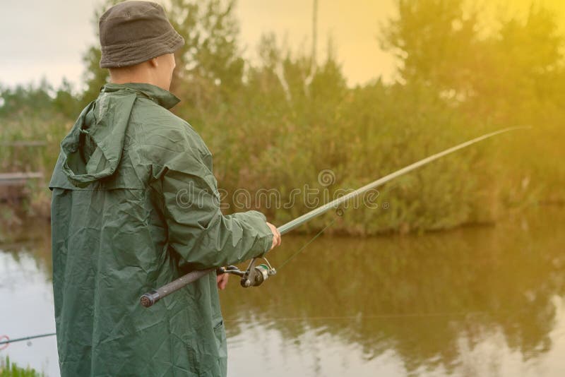 The Boy is Catching a Net by the Lake Stock Photo - Image of pond, fish ...