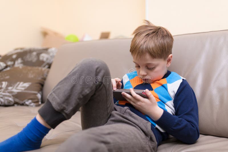 Boy with cellphone stock photo. Image of cellphone, electronics - 245456668