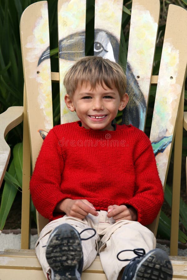 Boy on chair stock image. Image of young, blink, youth - 10803513