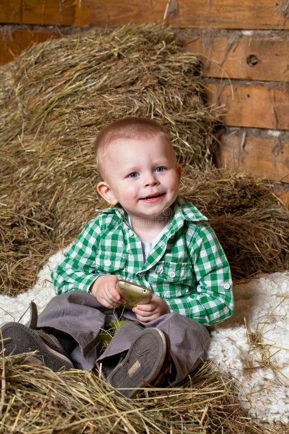 Boy in a checkered shirt stock image. Image of village - 24067851