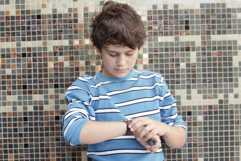 Young Boy Checking His Watch Stock Photos - Free & Royalty-Free Stock ...