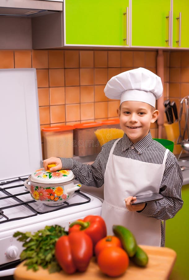 Boy Chef is Cooking on the Kitchen Stock Photo - Image of food, stove ...