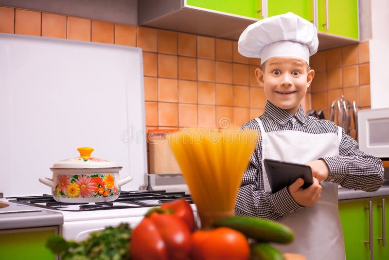 Boy Chef is Cooking on the Kitchen Stock Photo - Image of food ...