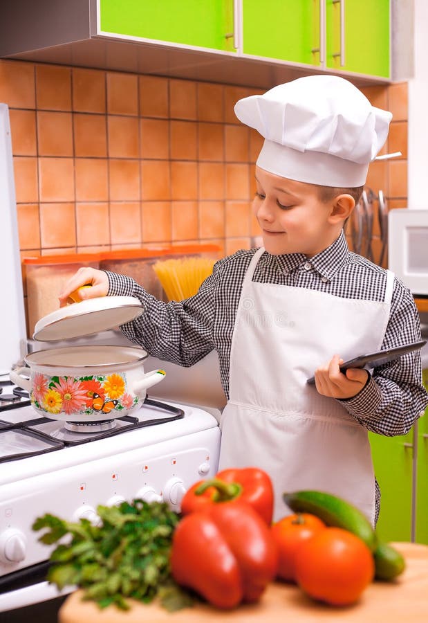 Boy Chef is Cooking in the Kitchen Stock Photo - Image of food, stove ...