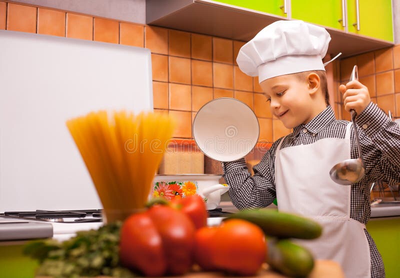 Boy Chef is Cooking in the Kitchen Stock Photo - Image of kitchen, chef ...