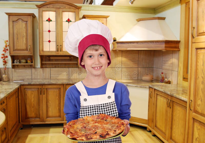 Boy chef eat pizza stock photo. Image of cook, crust - 33078172