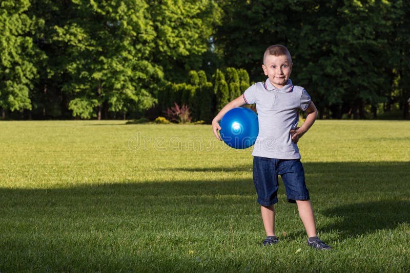 Boy children playing ball stock image. Image of park - 54436075