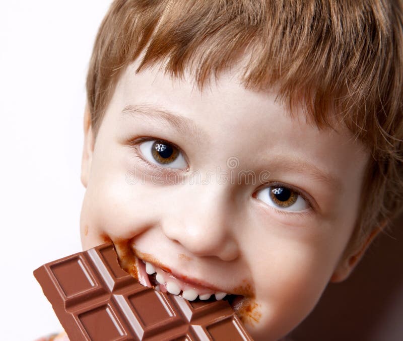 Boy with chocolate bar stock photo. Image of cute, child - 71608290