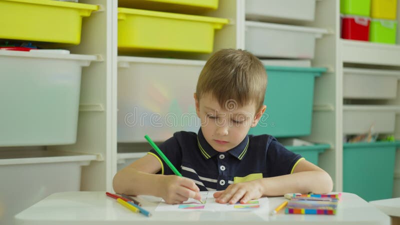 The Boy Chooses the Pencil he Needs and Completes the Task. Stock ...