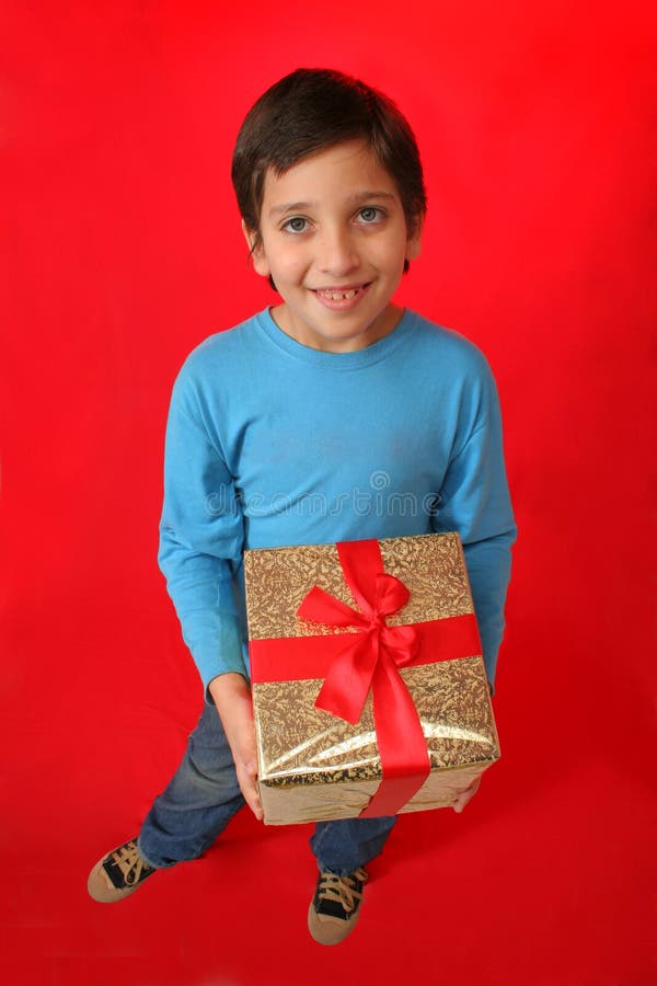Boy with a christmas gift stock image. Image of xmas, gift - 1216843