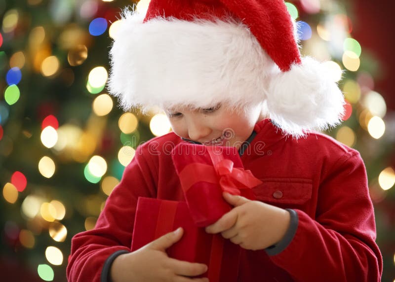 Boy with christmas present stock photo. Image of tree - 35713946