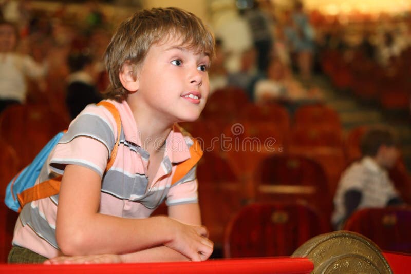 Boy in Circus Leans on Rail Looking into Distance Stock Photo - Image ...