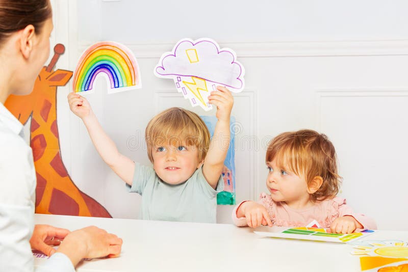 Boy in Class Show Weather Cards with Rain, Storm and Rainbow Stock ...