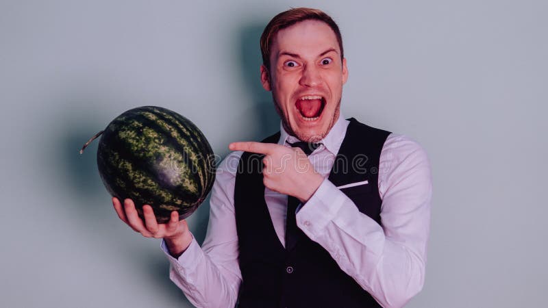 A Man and a Watermelon / Boy in Classic Suit with a Watermelon Stock ...