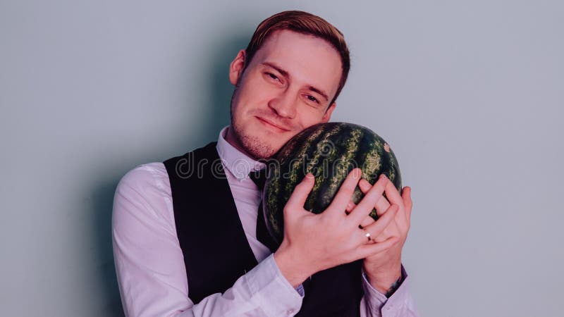 A Man and a Watermelon / Boy in Classic Suit with a Watermelon Stock ...