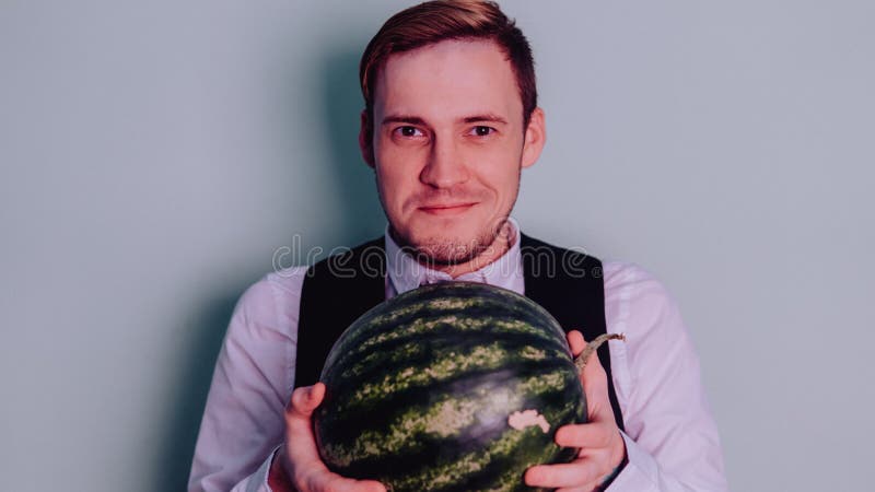 A Man and a Watermelon / Boy in Classic Suit with a Watermelon Stock ...
