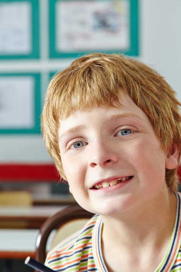 Boy in classroom smiling stock image. Image of inside - 51753985