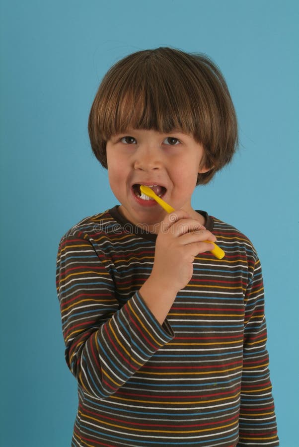 Boy cleaning his teeth stock photo. Image of hygiene - 24678036