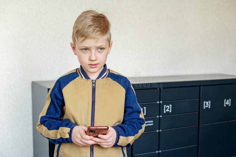 Boy Client Using Automated Self Service Post Terminal Machine or Locker ...