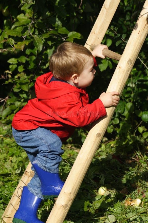 Boy Climbing Ladder stock photo. Image of blue, climb - 6918498