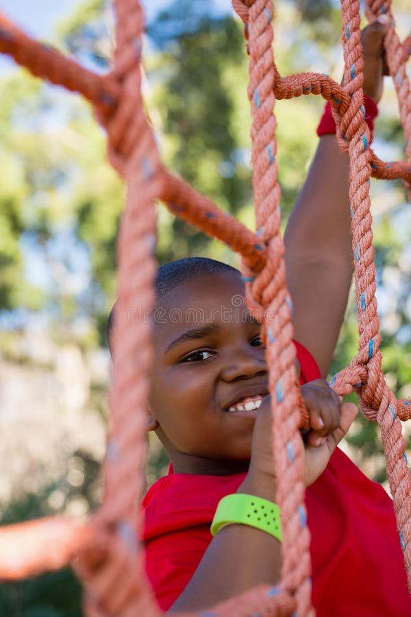 Boy Climbing a Net during Obstacle Course Training Stock Photo - Image ...
