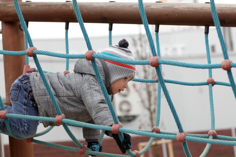 Boy climbing on rope stock image. Image of healthy, action - 40577697