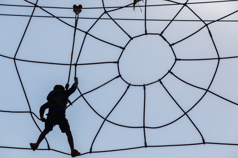 Boy Climbing Spiderweb stock image. Image of silhouetted - 101281019