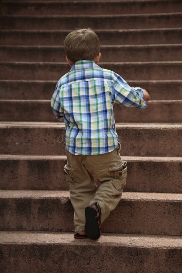 Boy Climbing Stairs stock image. Image of teach, play - 2513897