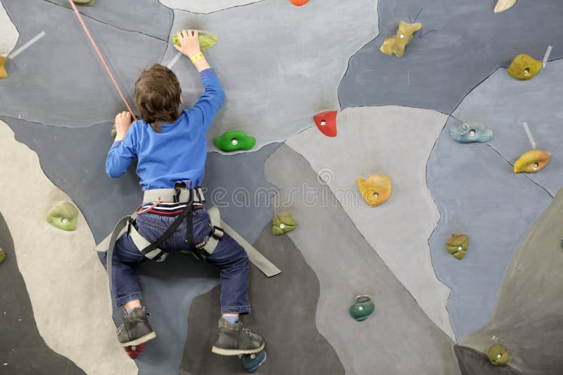Boy on climbing wall stock image. Image of bouldering - 92158007