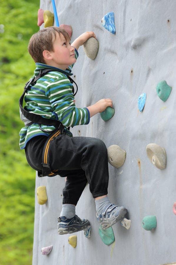 Boy on climbing wall stock image. Image of training, risk - 80179881