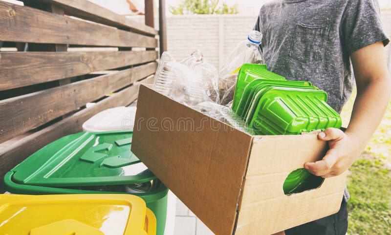 The Boy Collect the Plastic Trash into the Paper Box Stock Image ...