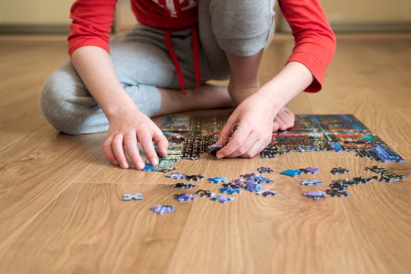 Boy Collect Puzzle Sitting on the Floor. Solving Difficult Tasks or ...