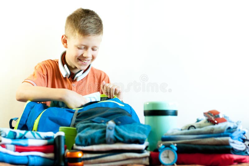 The Boy Collects His Things on the Trip Stock Photo - Image of column ...