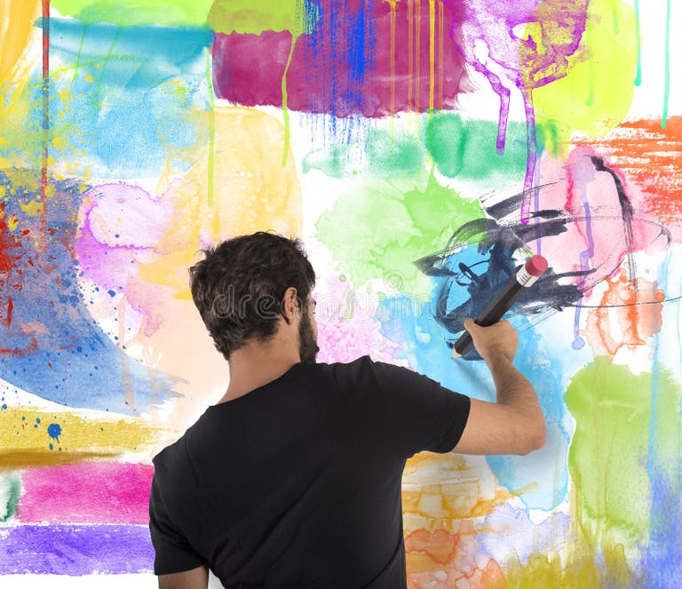 Boy colors a wall stock photo. Image of outdoor, creativeness - 54612864