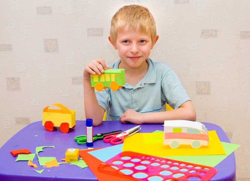 The Boy with a Colour Paper Stock Image - Image of hand, collected ...