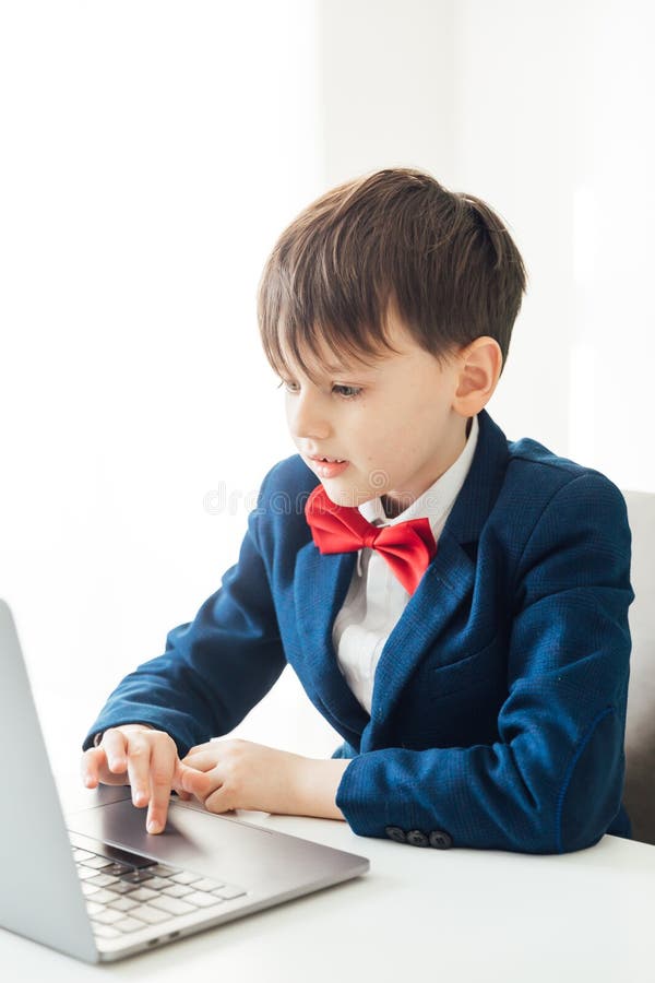 Boy at the Computer in the Classroom Learning Online Stock Image ...