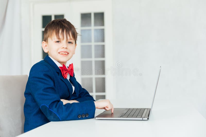 Boy at the Computer in the Classroom Learning Online Stock Photo ...