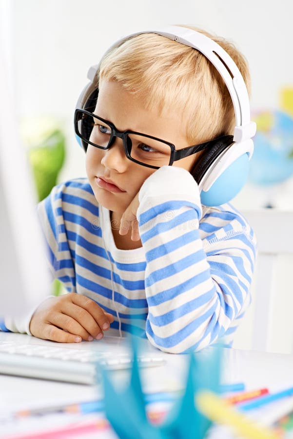 Boy using computer at home stock image. Image of computers - 34411323