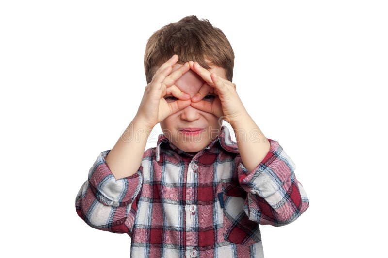 A Boy with a Concentrated Expression on His Face is Closely Watching ...