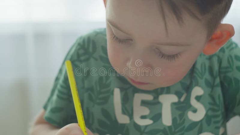 The Boy Concentrates on Drawing the Task in Yellow. Stock Footage ...