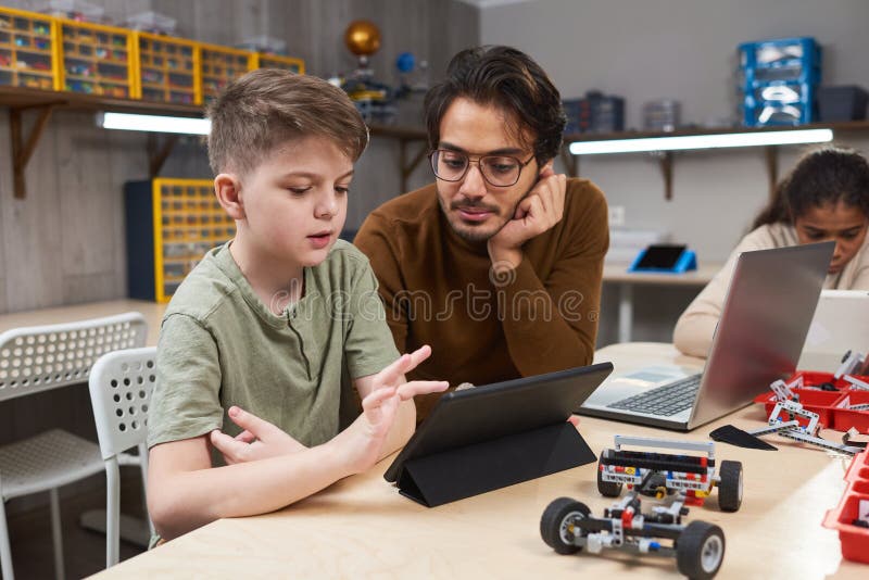 Boy Controlling the Robot from a Tablet Pc Stock Image - Image of ...