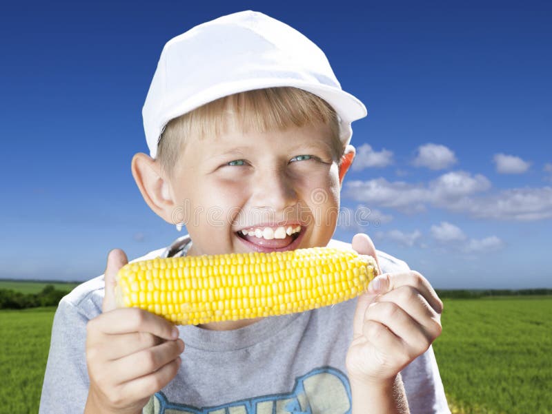 Boy and hot corn stock photo. Image of little, bite, cereal - 43137996
