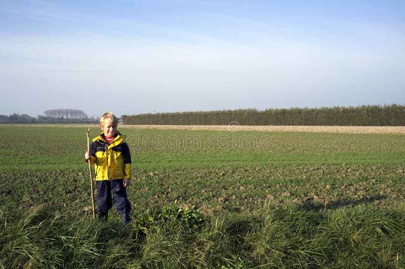 Boy in countryside stock image. Image of coat, hedge - 22683831