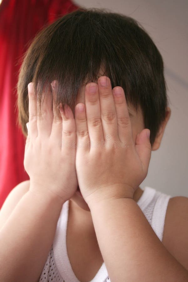 Boy covering face stock image. Image of young, concept - 969155