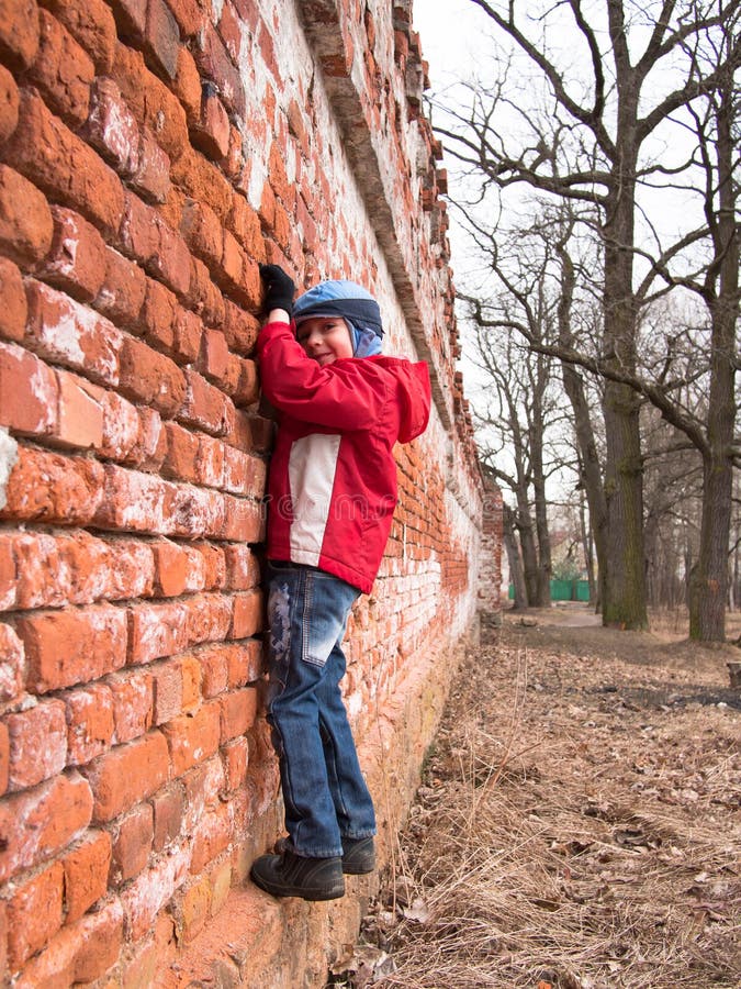 Boy crawling on the wall stock image. Image of human - 39408225