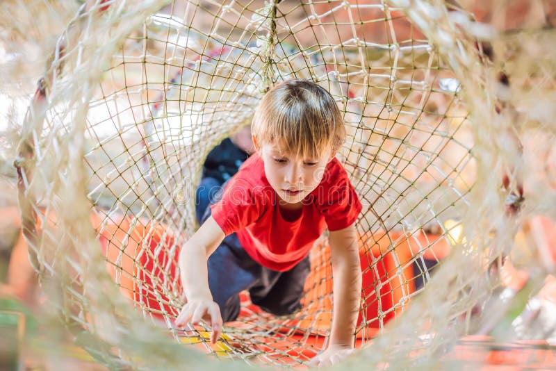 Boy Crawls on a Net in an Obstacle Course Stock Image - Image of camp ...