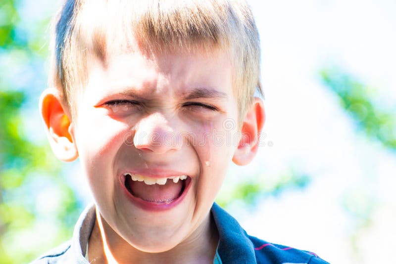 The Boy Cries Tears in the Daytime on the Street and Needs Pity, Close ...